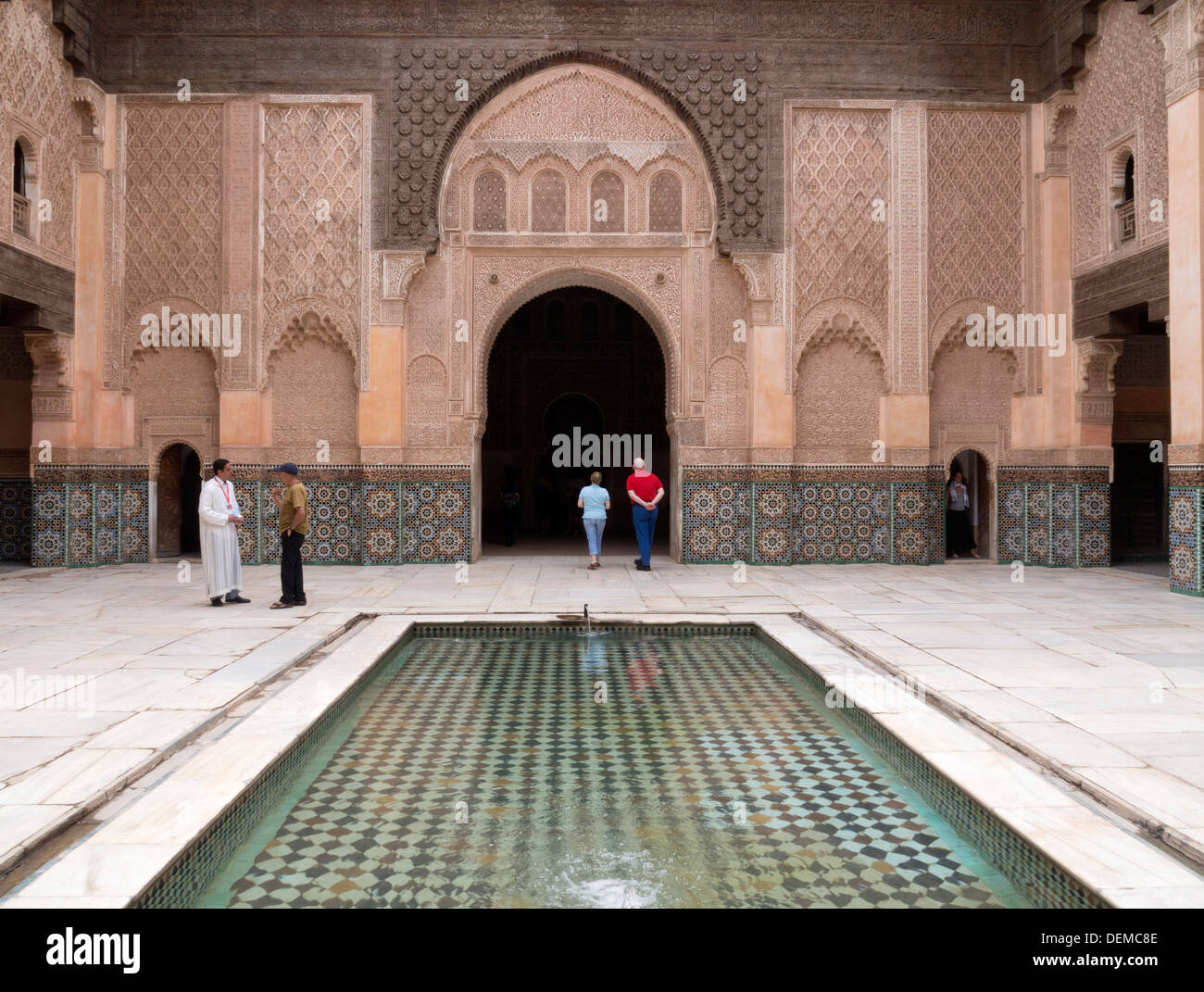 Tourists inside the Ben Youssef madrasa courtyard in Marrakesh, Morocco ...