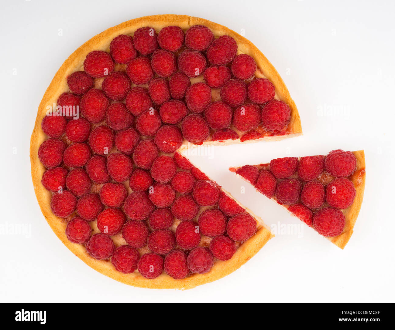 Raspberry tart with slice cut out isolated on white background Stock ...