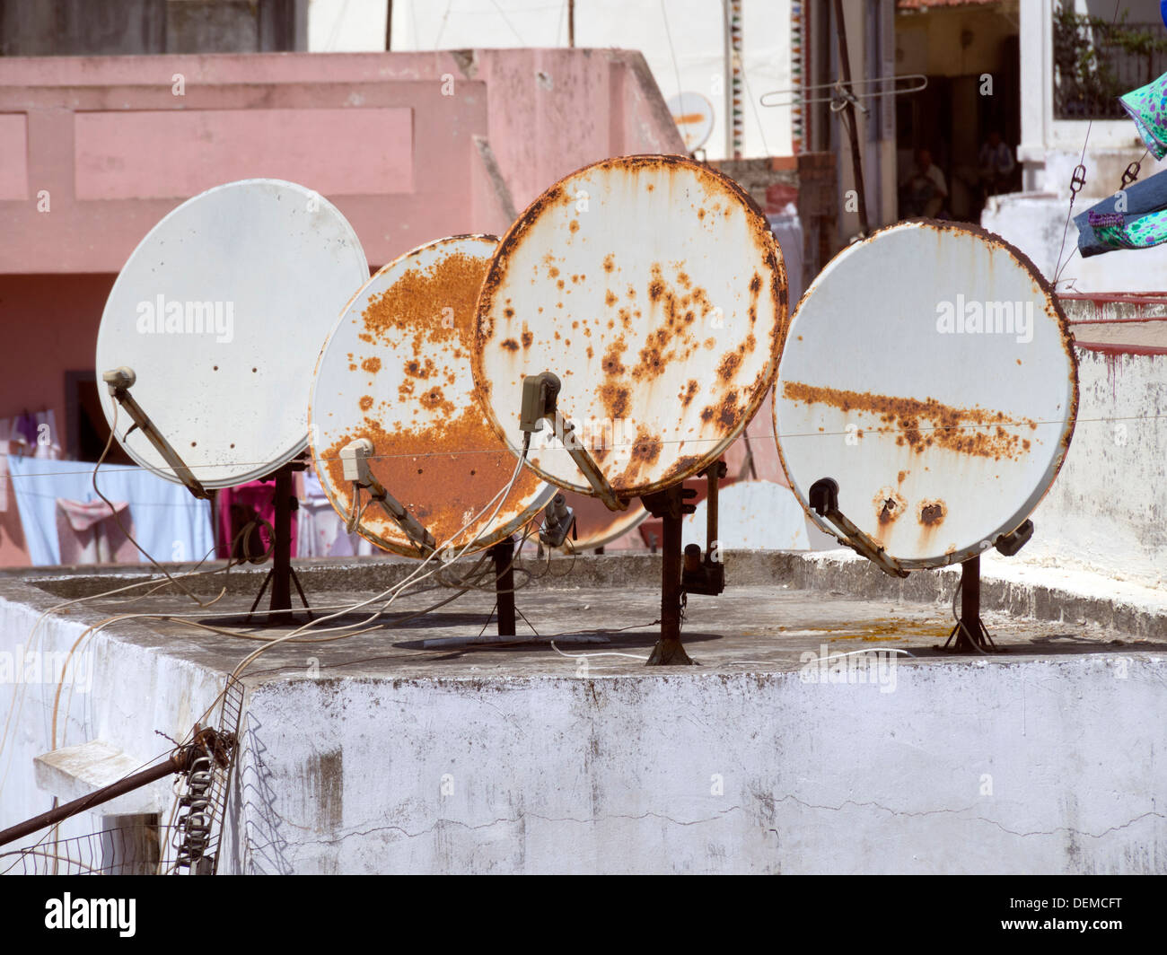 Four rusty parabolic satellite dishes Stock Photo - Alamy