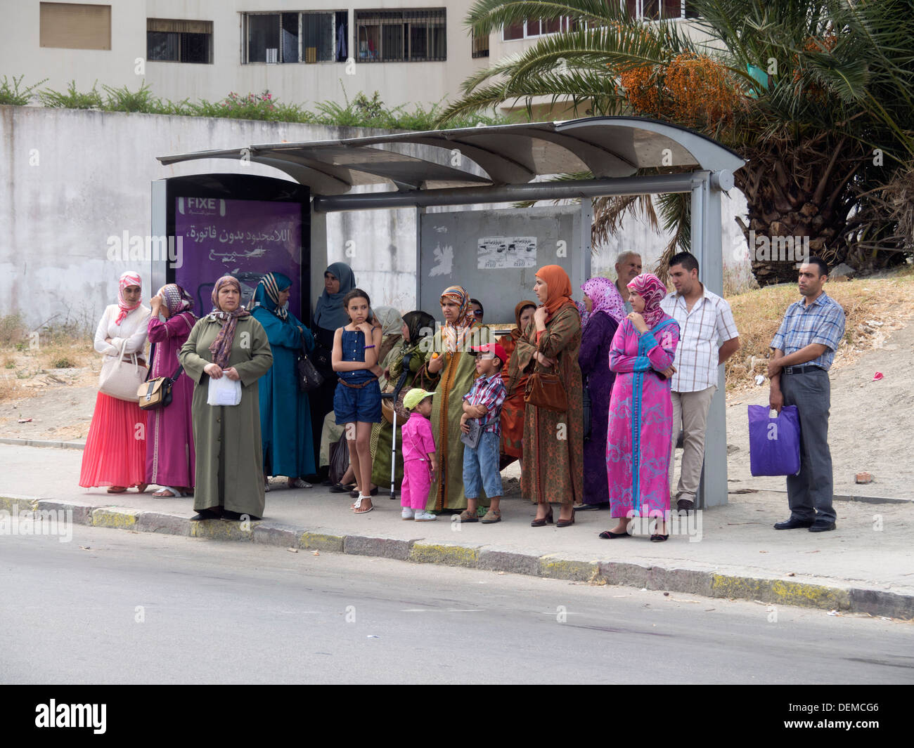 People waiting for bus at a bus stop, Fez, Morocco Stock Photo - Alamy
