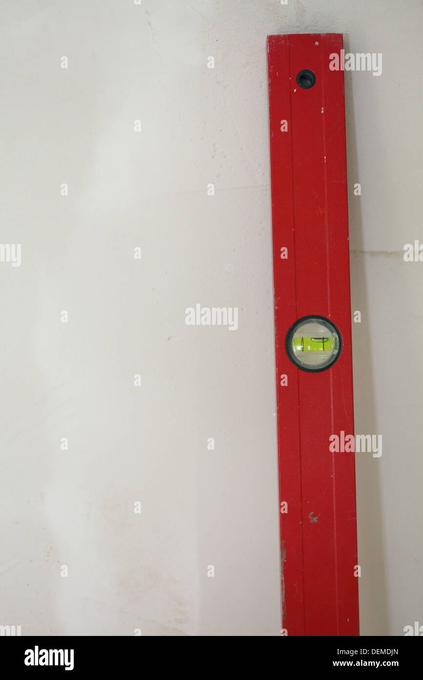 Red balance spirit building level in construction site Stock Photo - Alamy
