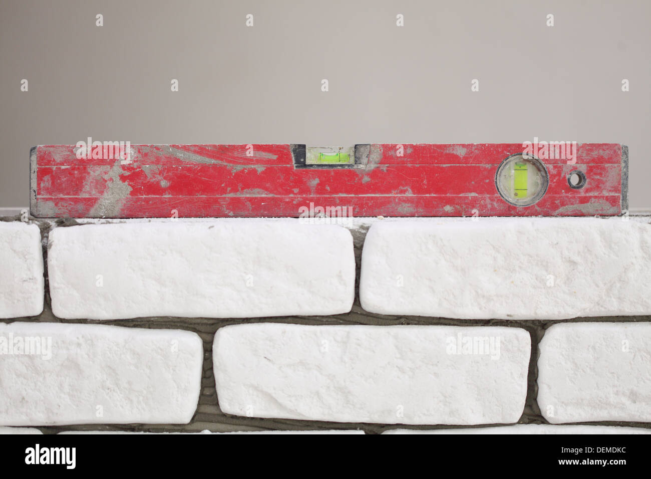 Red balance spirit building level in construction site. Check the level ...