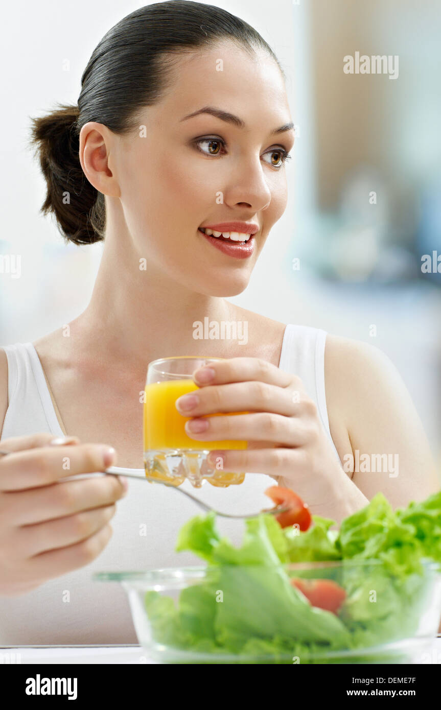 A beautiful slender girl eating healthy food Stock Photo - Alamy