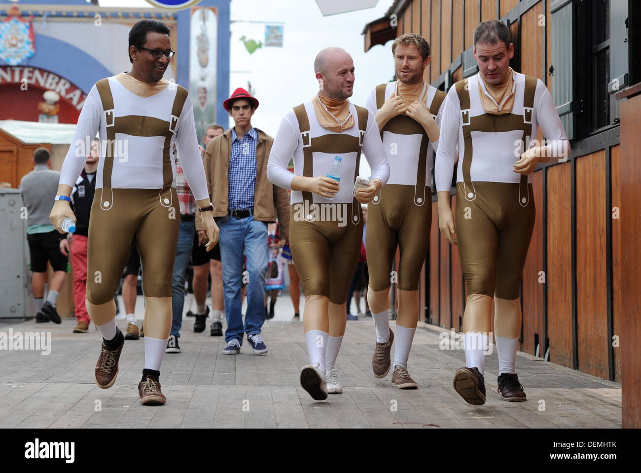 Munich, Germany. 21st Sep, 2013. Visitors wearing body suits arrive at ...