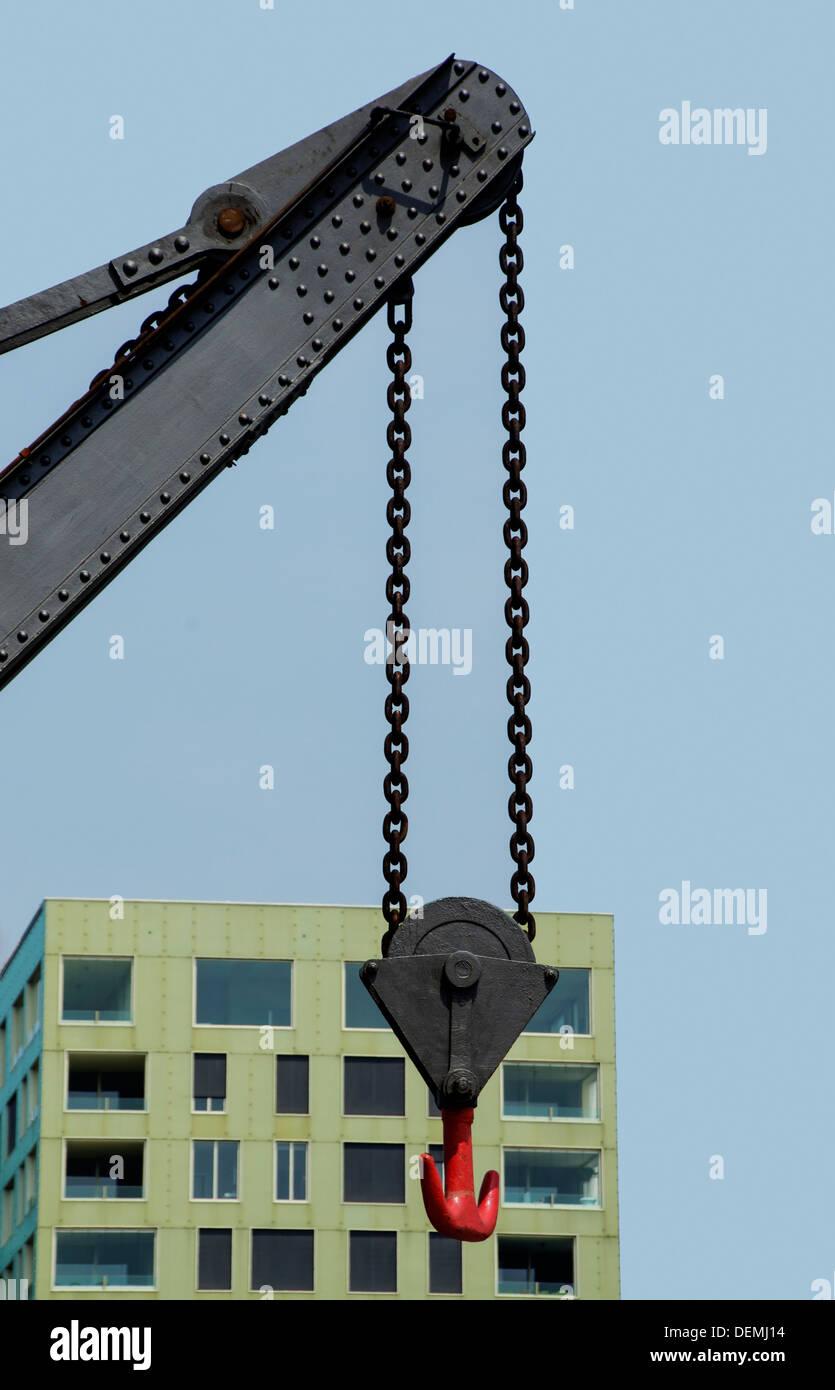 Construction crane in front of a building Stock Photo - Alamy