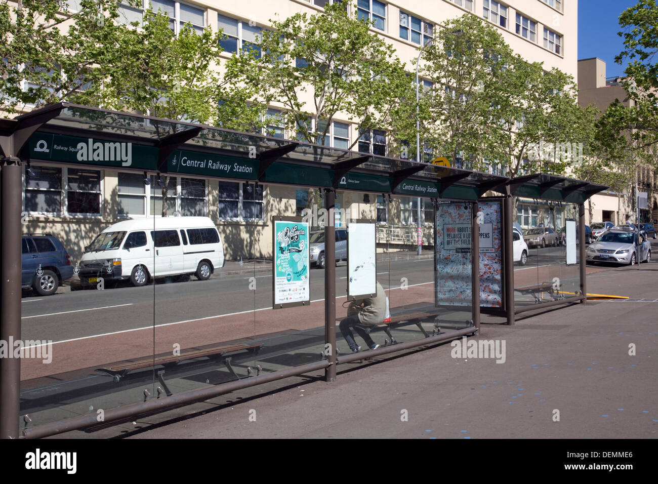 person sitting at a bus stop on Chalmers Street,sydney,australia Stock ...