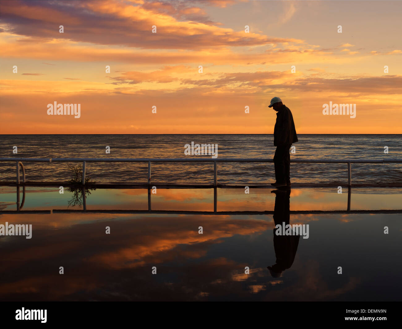 Old man walking rain hi-res stock photography and images - Alamy