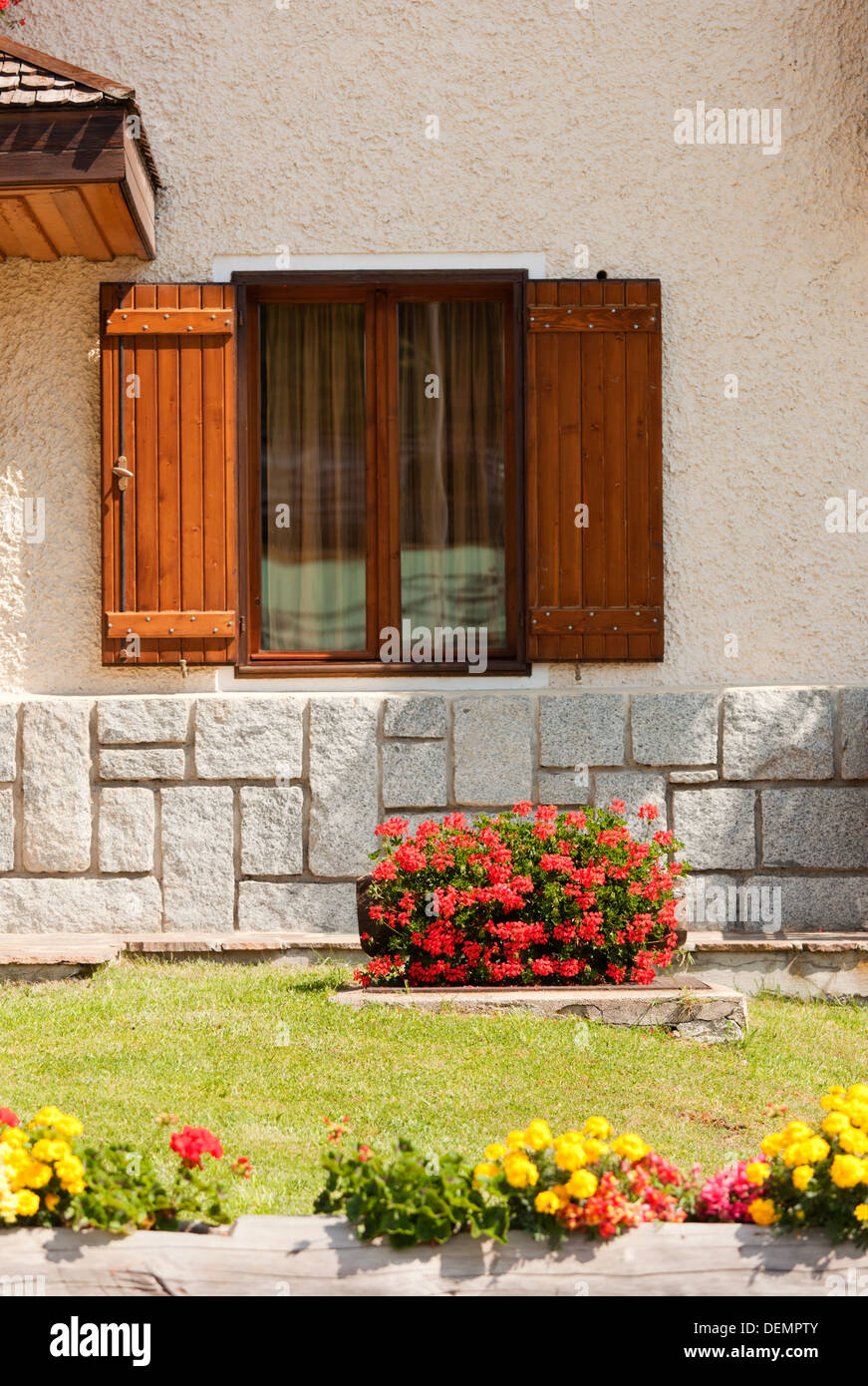 Rustic window decorated with flowers in Madonna di Campiglio Stock ...