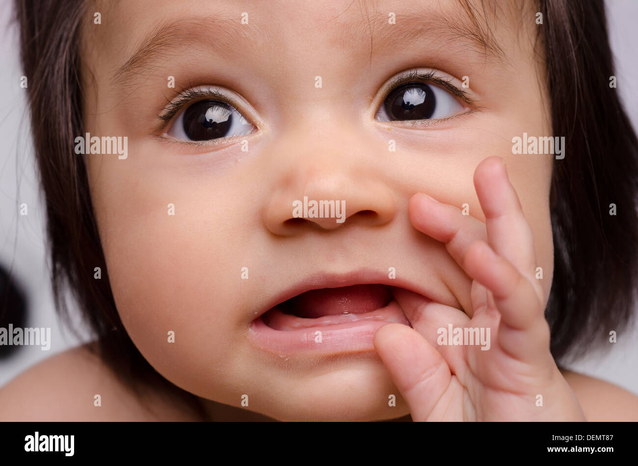 Teething baby girl hi-res stock photography and images - Alamy