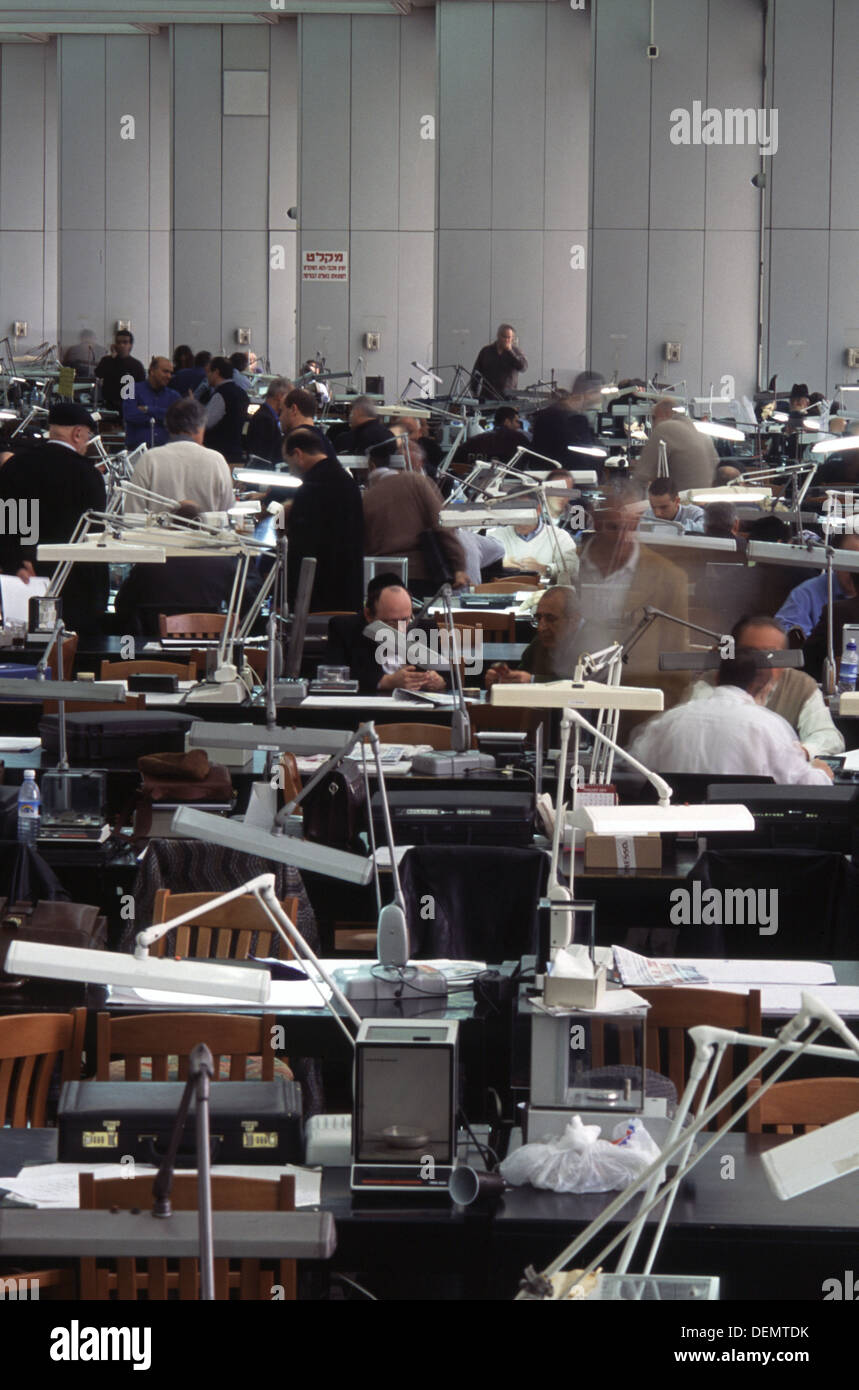 Diamantaires are engaged in diamond cutting and trading at the trading ...