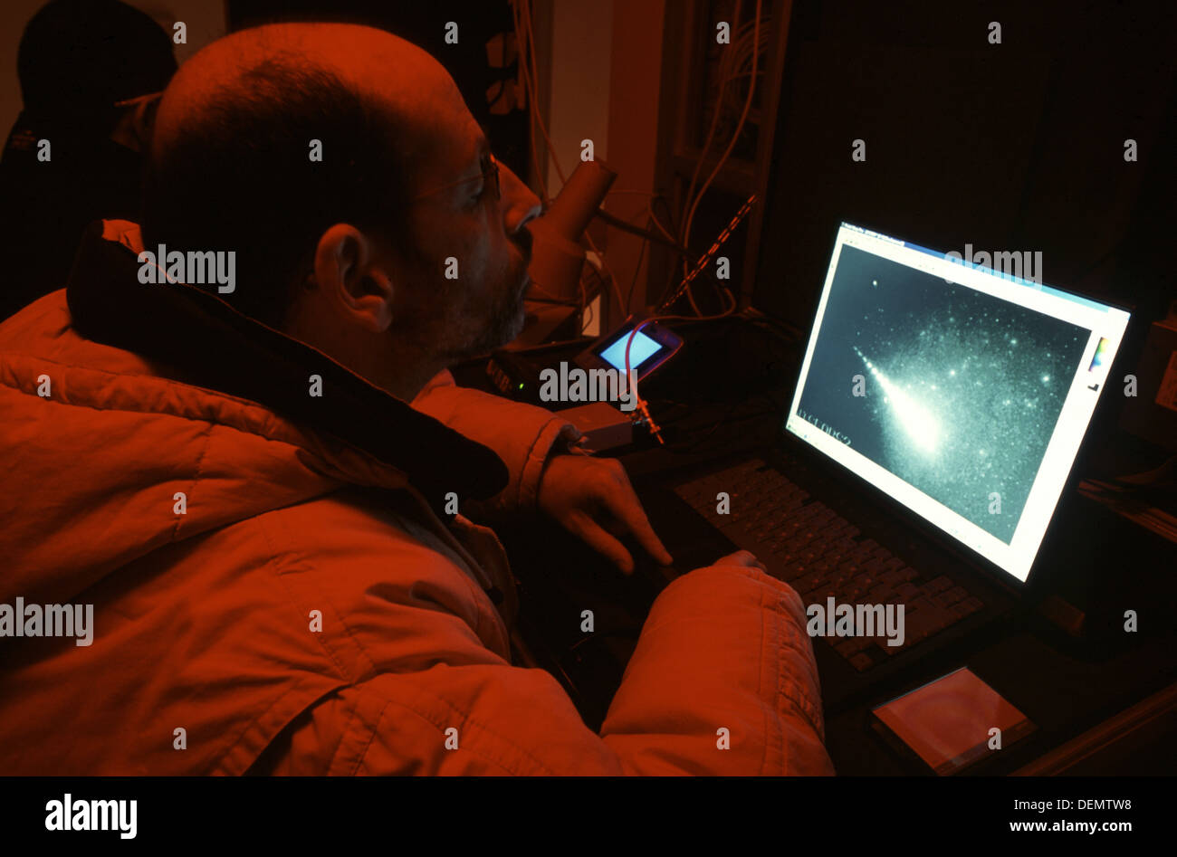 An Israeli astronomer views star trails through computer at the ...