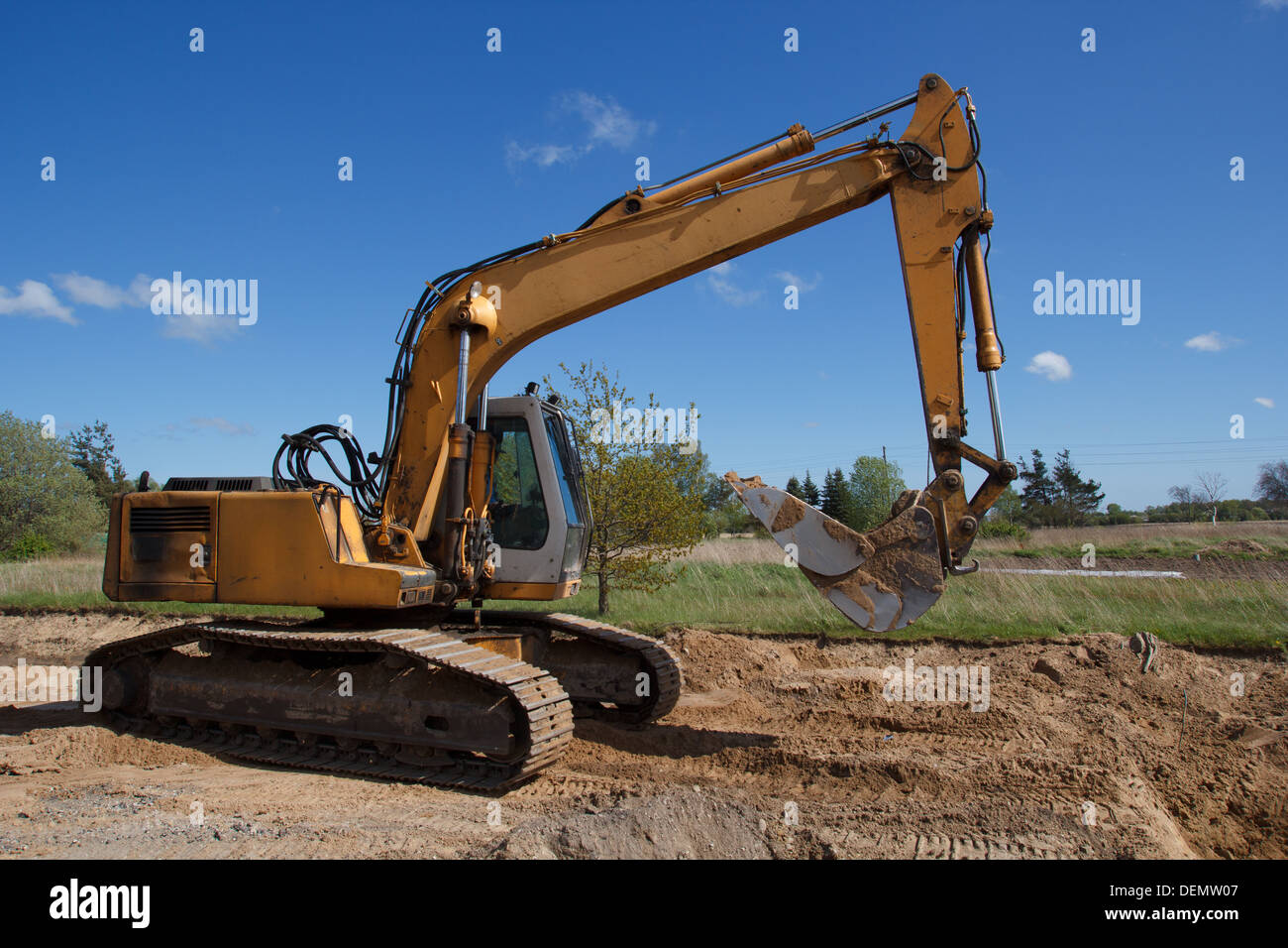 excavator working on a construction site Stock Photo - Alamy