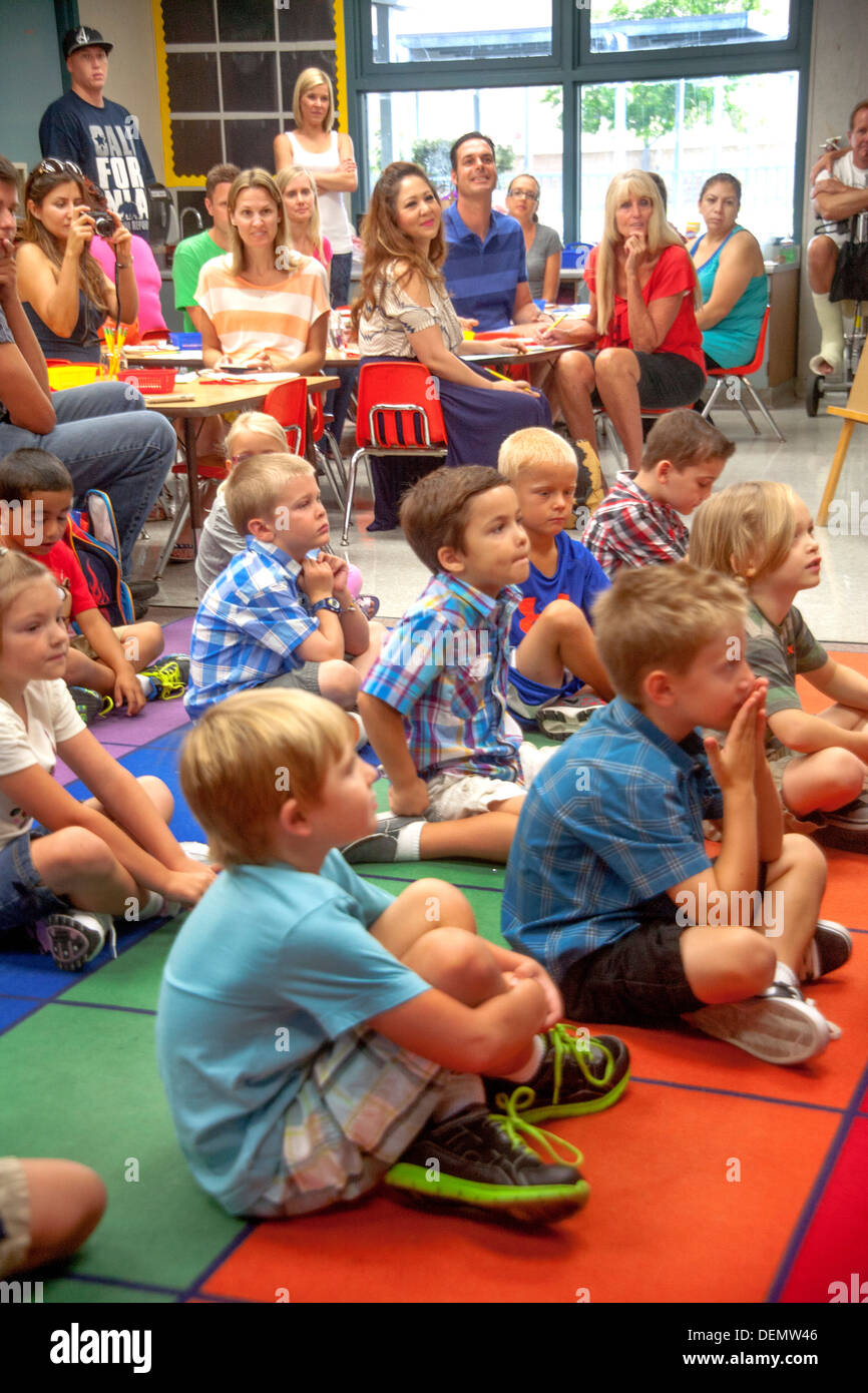 Students' parents join kindergarten class on the first day of primary ...