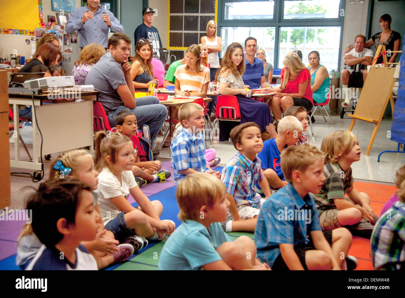 Students' parents join kindergarten class on the first day of primary ...