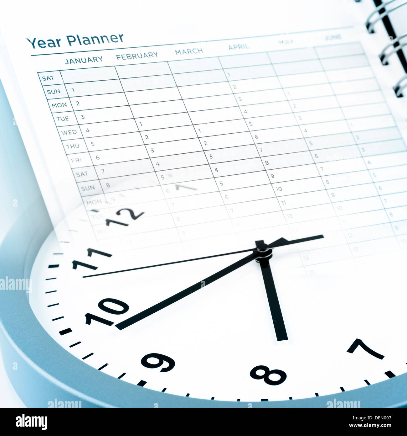 Clock face and year planner Stock Photo - Alamy