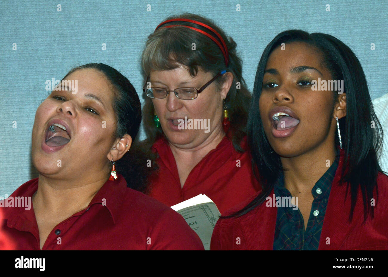 Three women singing in a choir in Riverdale Park, Md Stock Photo - Alamy