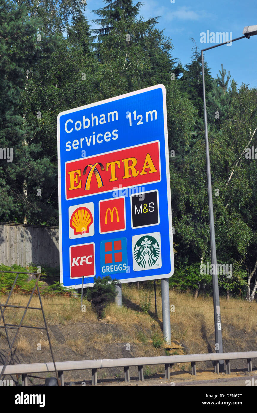 A British road sign indicating a motorway services is ahead with a ...