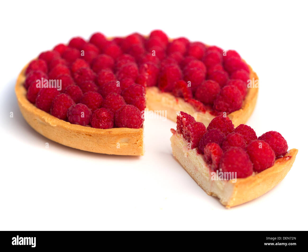 Raspberry tart with slice cut out isolated on white background Stock ...