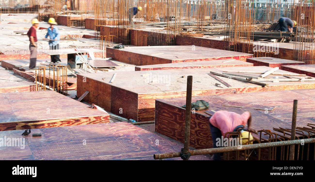building under construction with workers Stock Photo - Alamy
