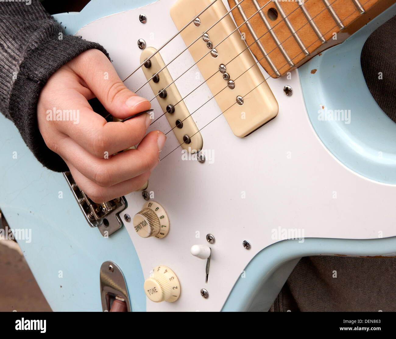 Close up electric guitar being played Stock Photo - Alamy