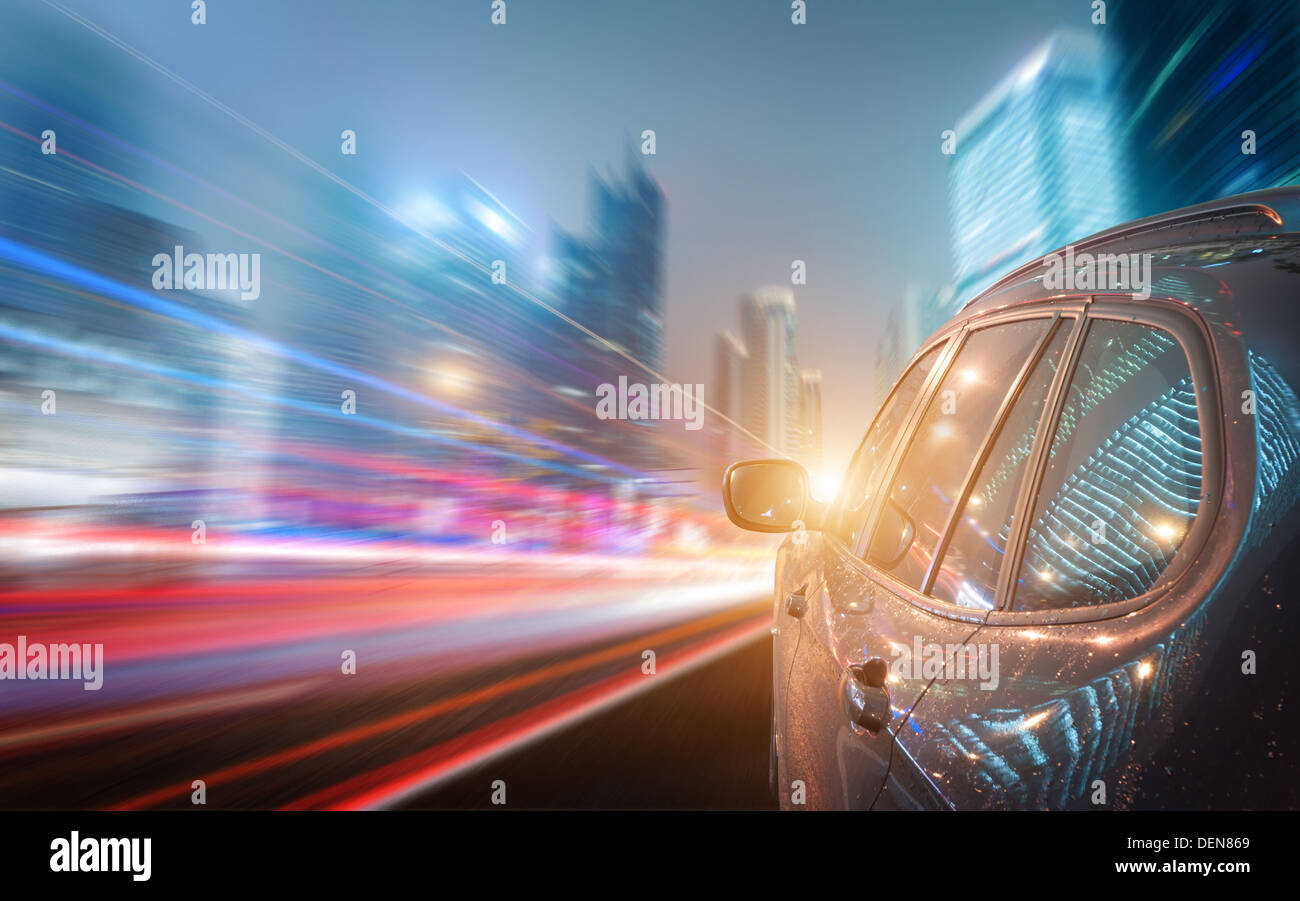 A car driving on a motorway at high speeds, overtaking other cars Stock ...