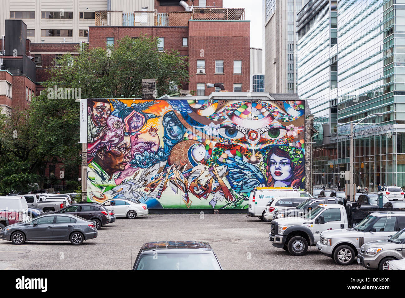 Approved Street art in a Car parking area - colourful mural of faces ...