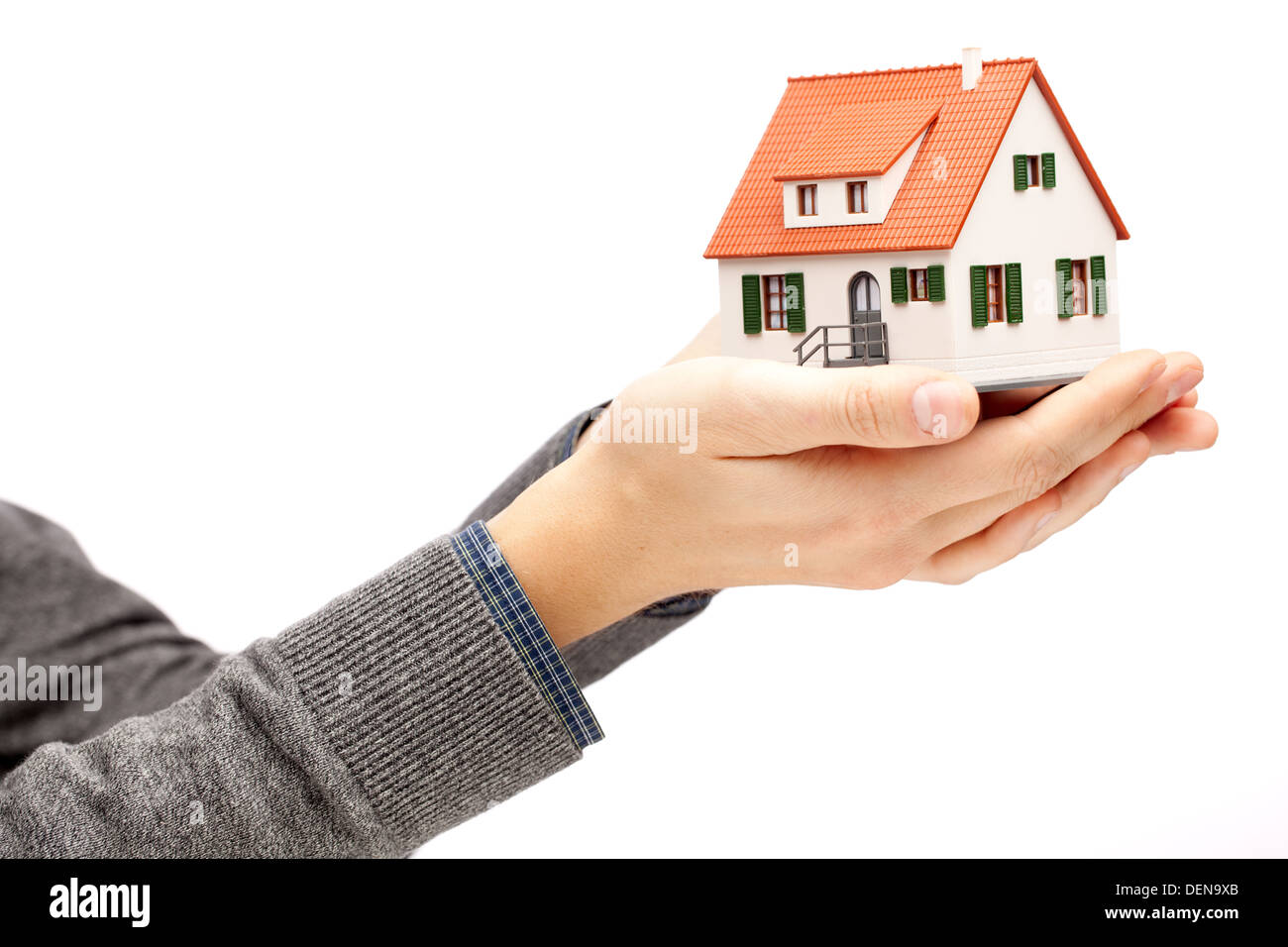 Hands holding a small house Stock Photo - Alamy