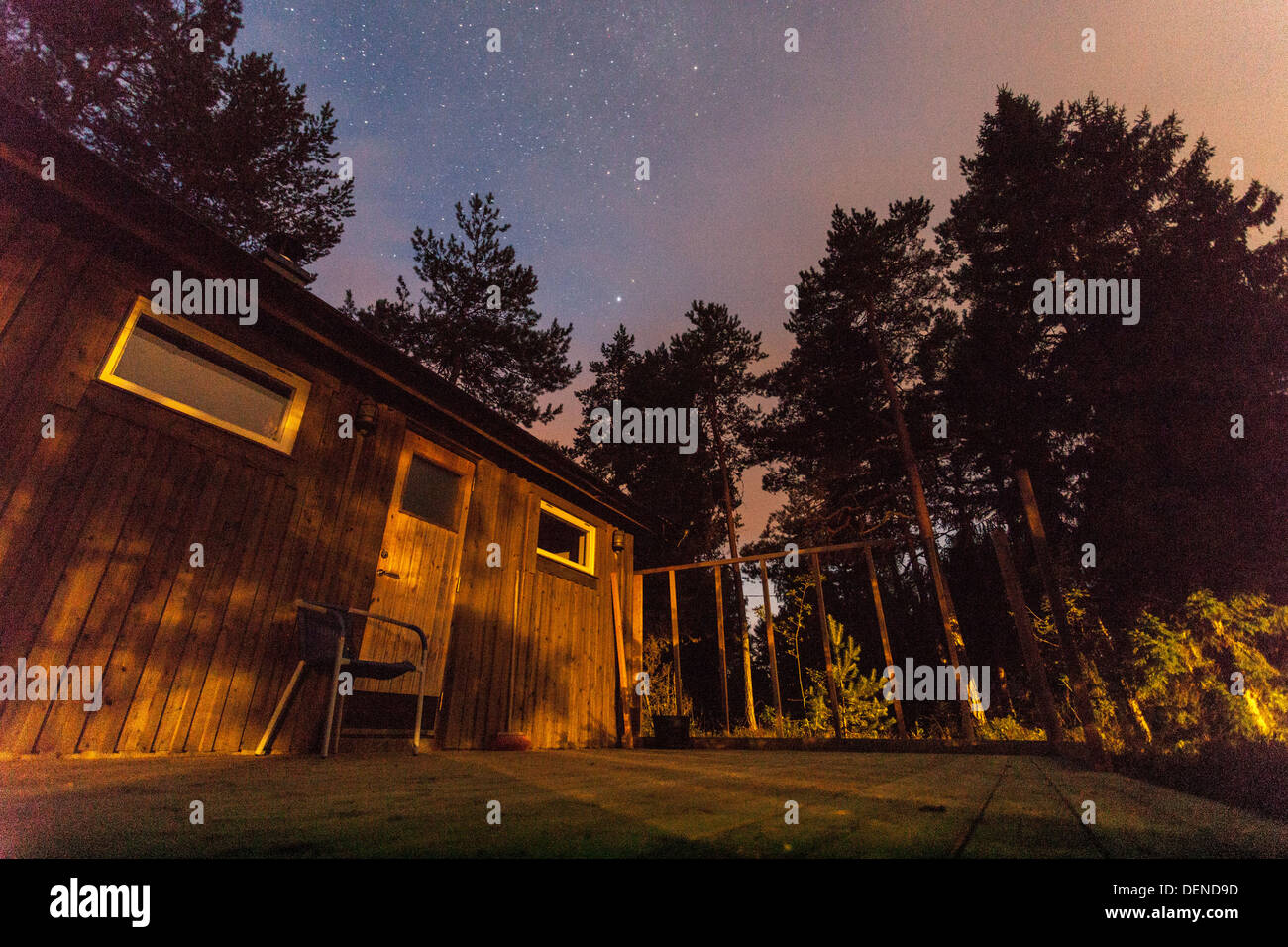 Cabin by night Stock Photo - Alamy