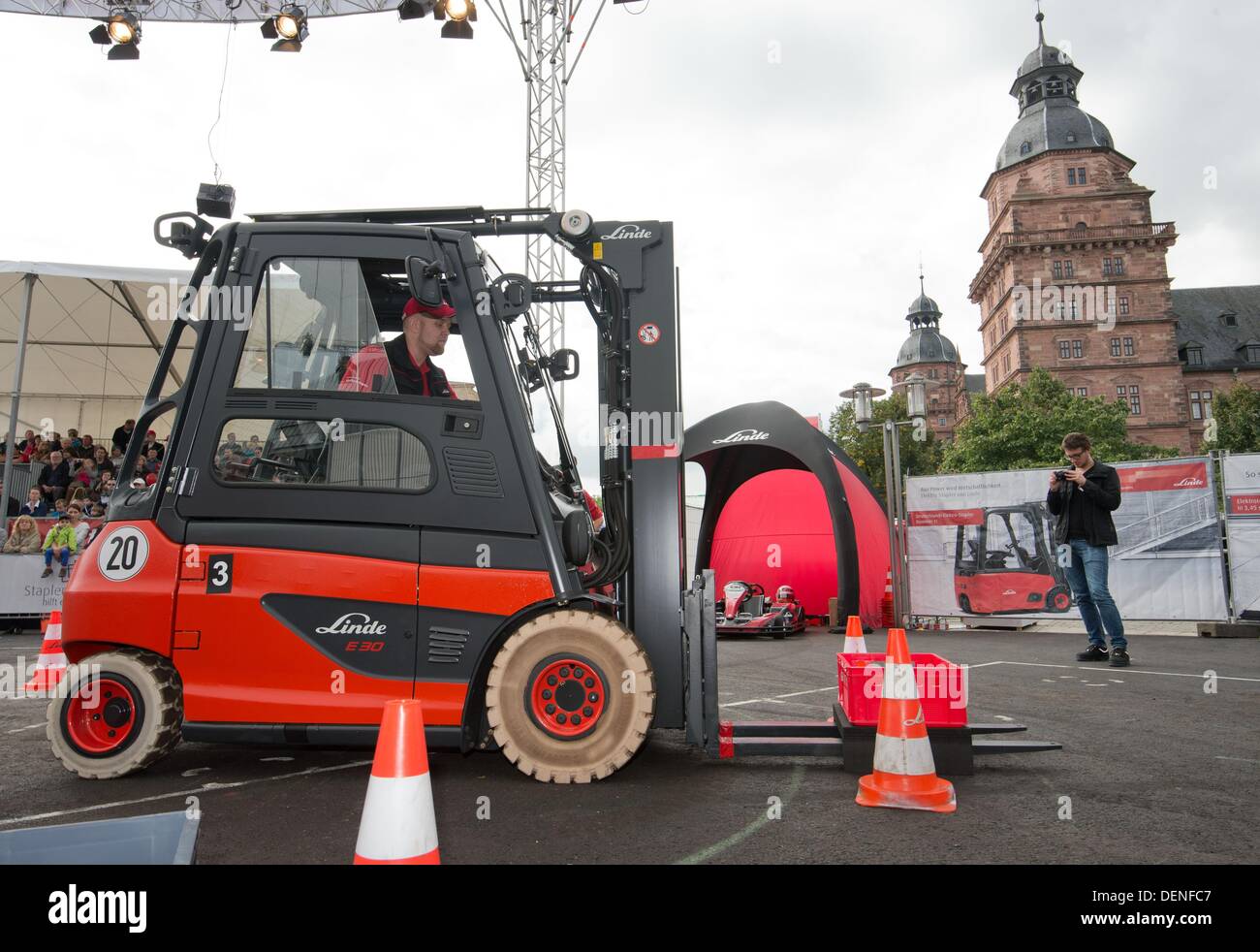 A participant of the German forklift truck championships drives along a ...