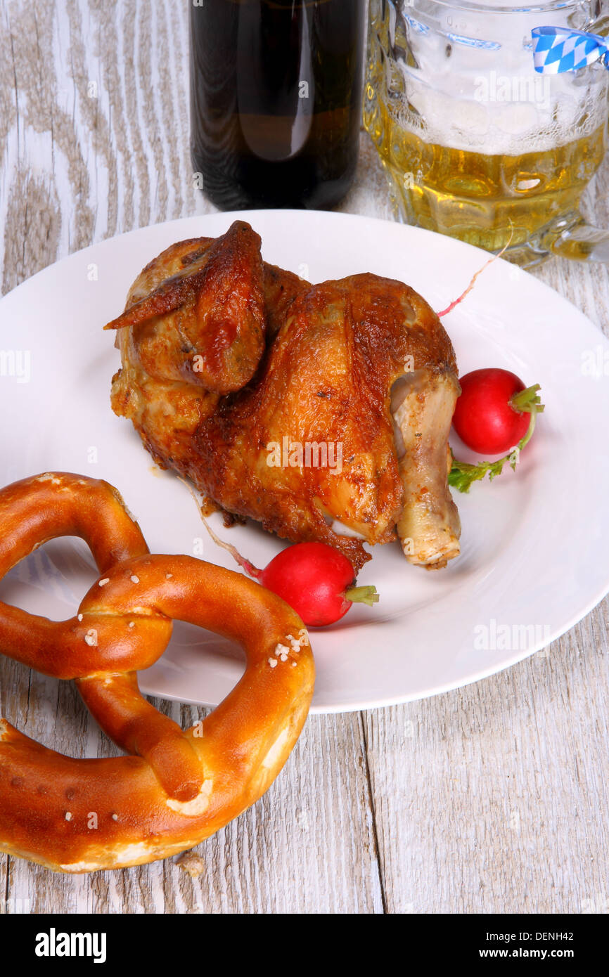 Oktoberfest chicken with pretzel, radish and beer, close up Stock Photo ...