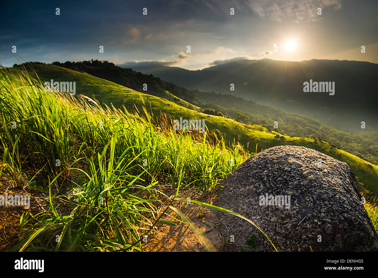 view of the sun rising from the hills of Broga Stock Photo - Alamy
