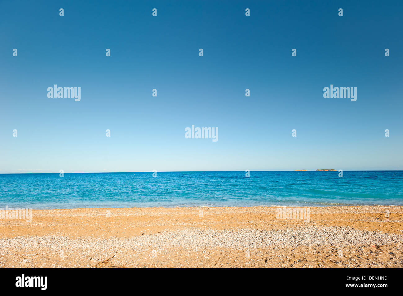 sand-and-pebble beach and a quiet, calm sea Stock Photo - Alamy