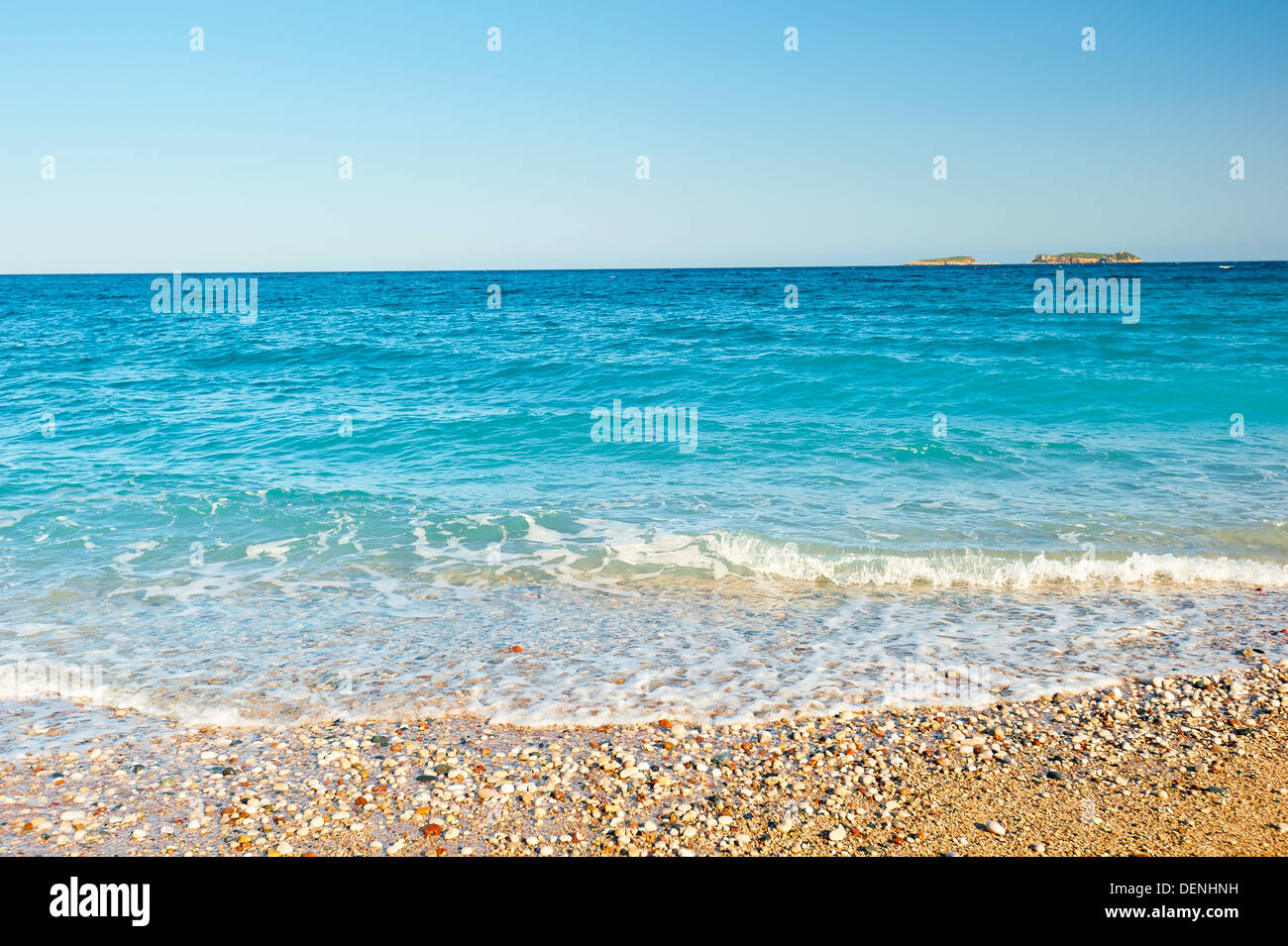sea wave rolls on the sand and shingle beach at sunrise Stock Photo - Alamy