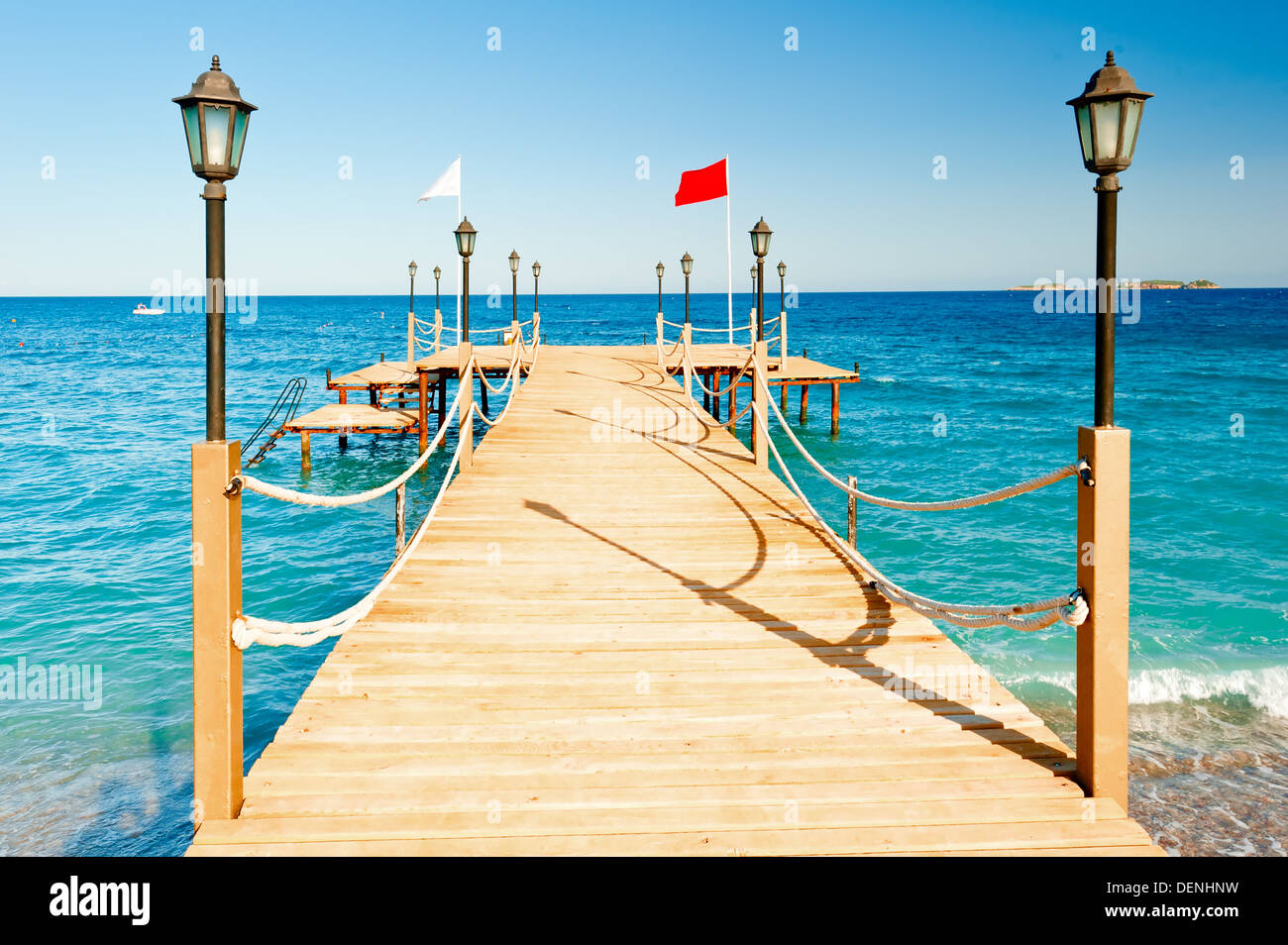 light poles and rope fence on wooden pier Stock Photo - Alamy
