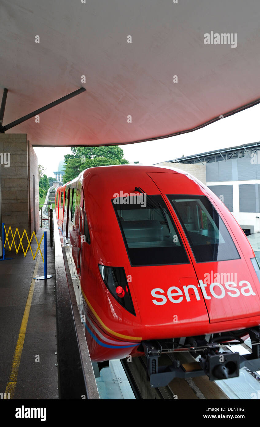 The red Sentosa island monorail train exiting the station Stock Photo ...