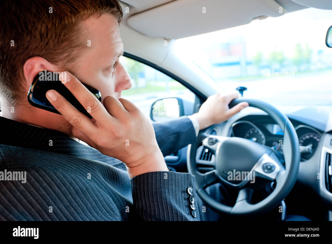 Driving and talking on the phone hi-res stock photography and images ...