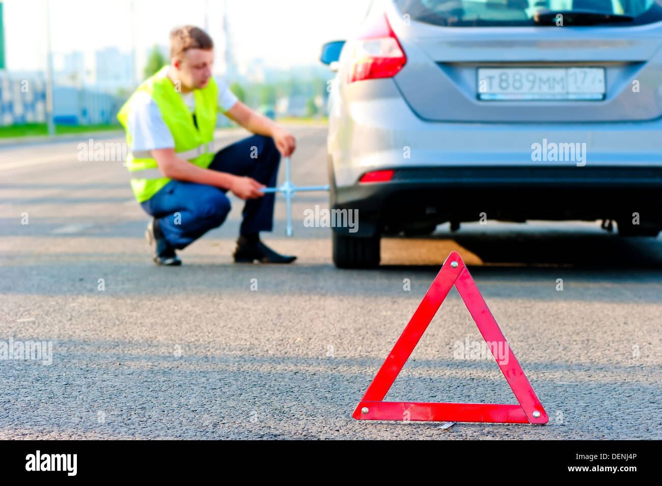 warning triangle and help the mechanic on the road Stock Photo - Alamy