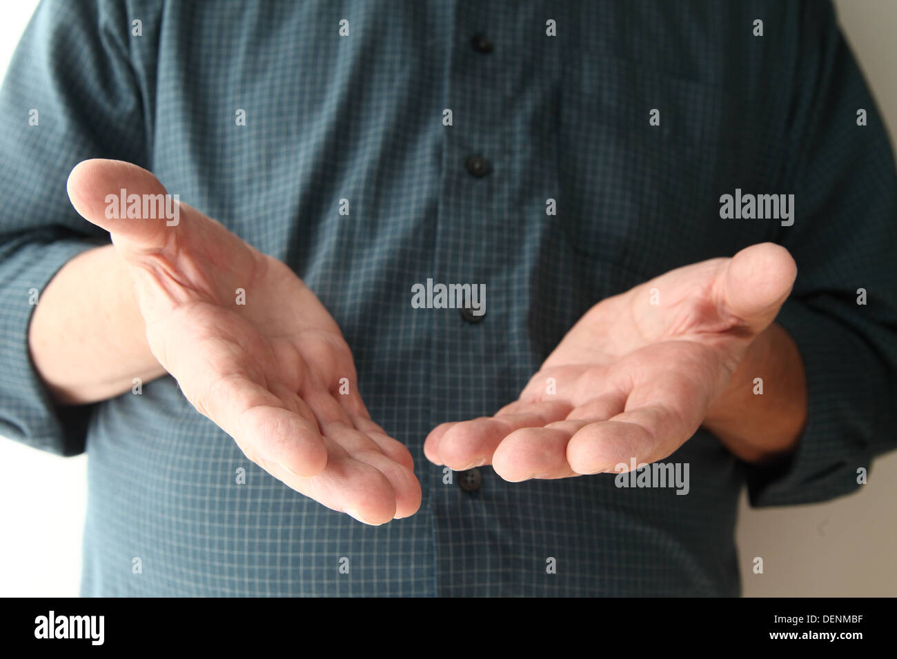 man holds his hands out in a gesture with several meanings Stock Photo ...