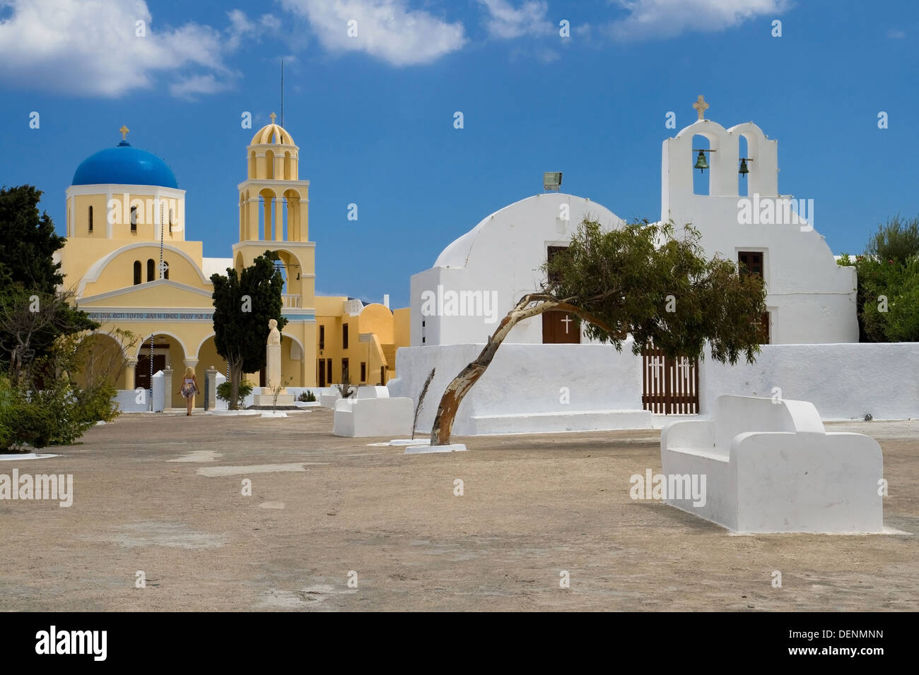 Traditional cycladic churches on a square of Oia, Santorini island ...