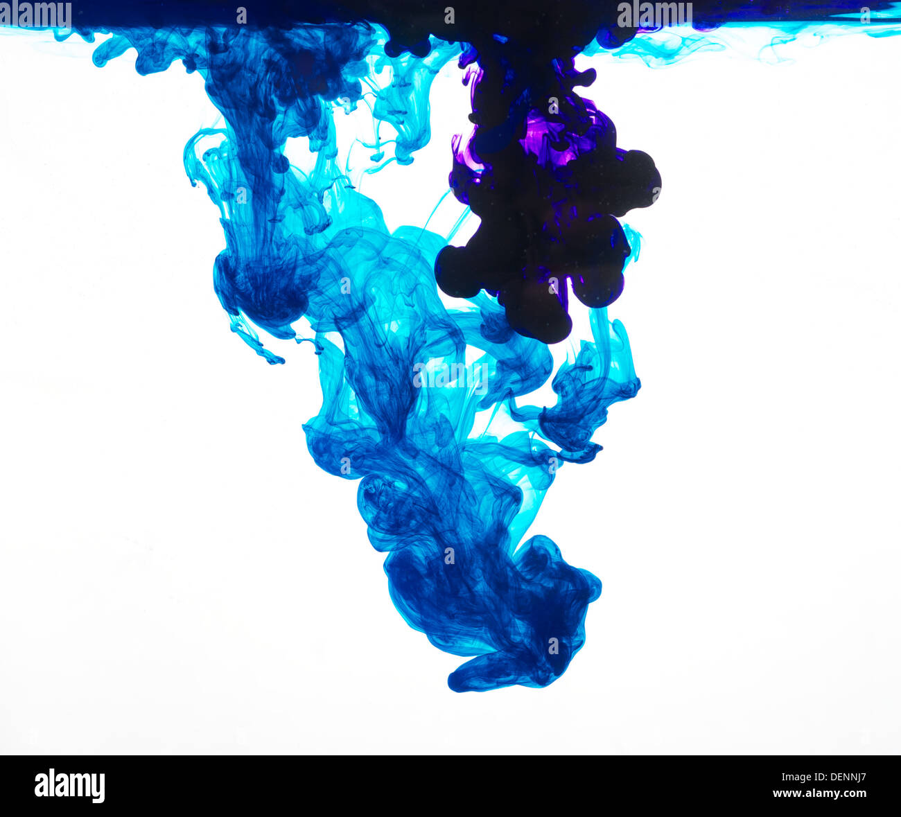 inks in water on white background Stock Photo - Alamy