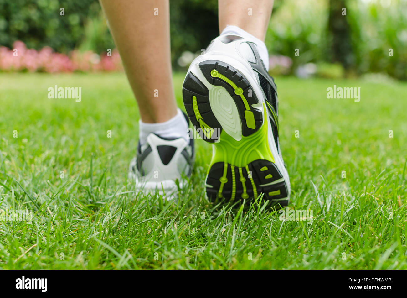 Woman feet in sneakers walking hi-res stock photography and images - Alamy