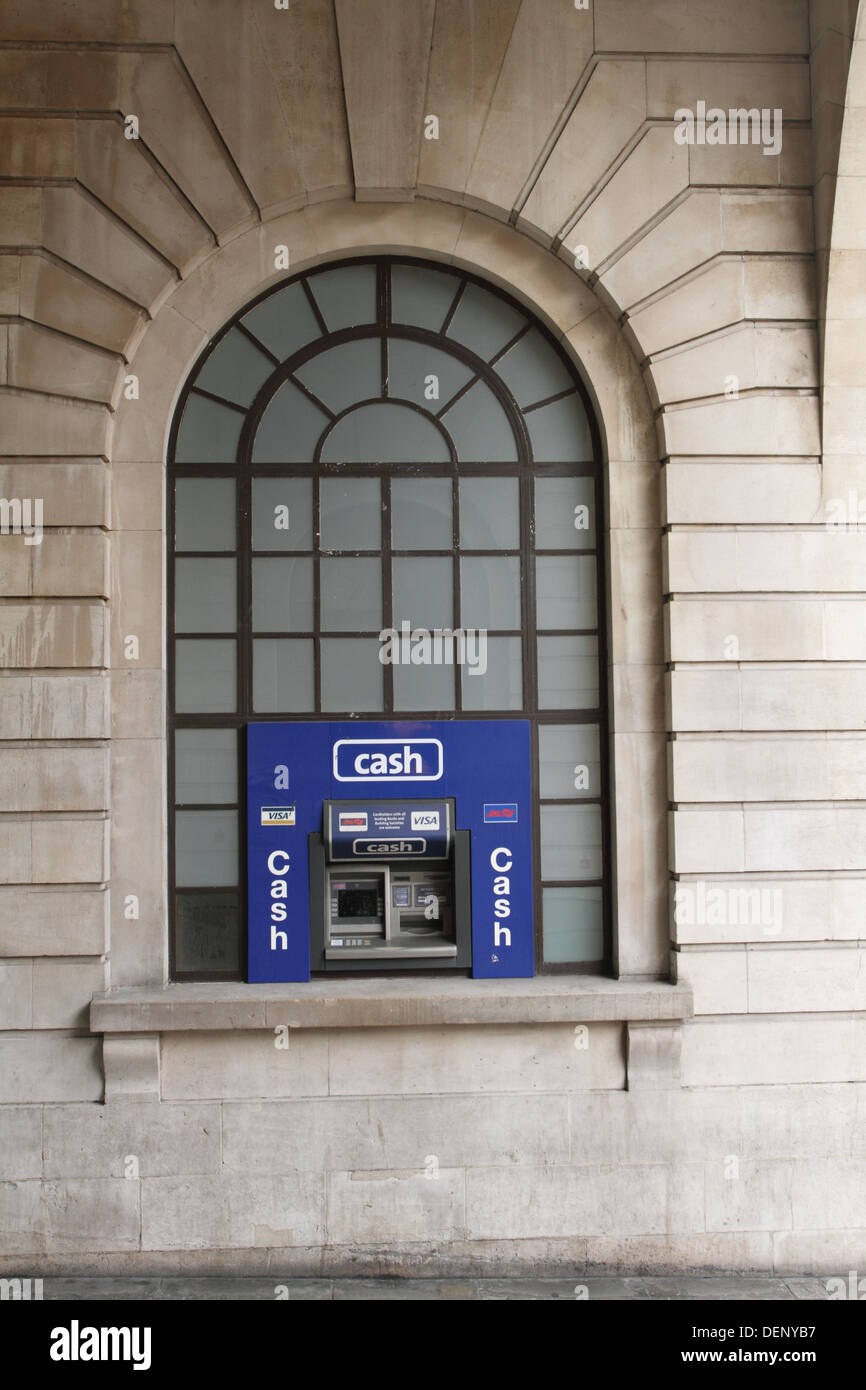 ATM cash dispenser set in an arched window Stock Photo - Alamy