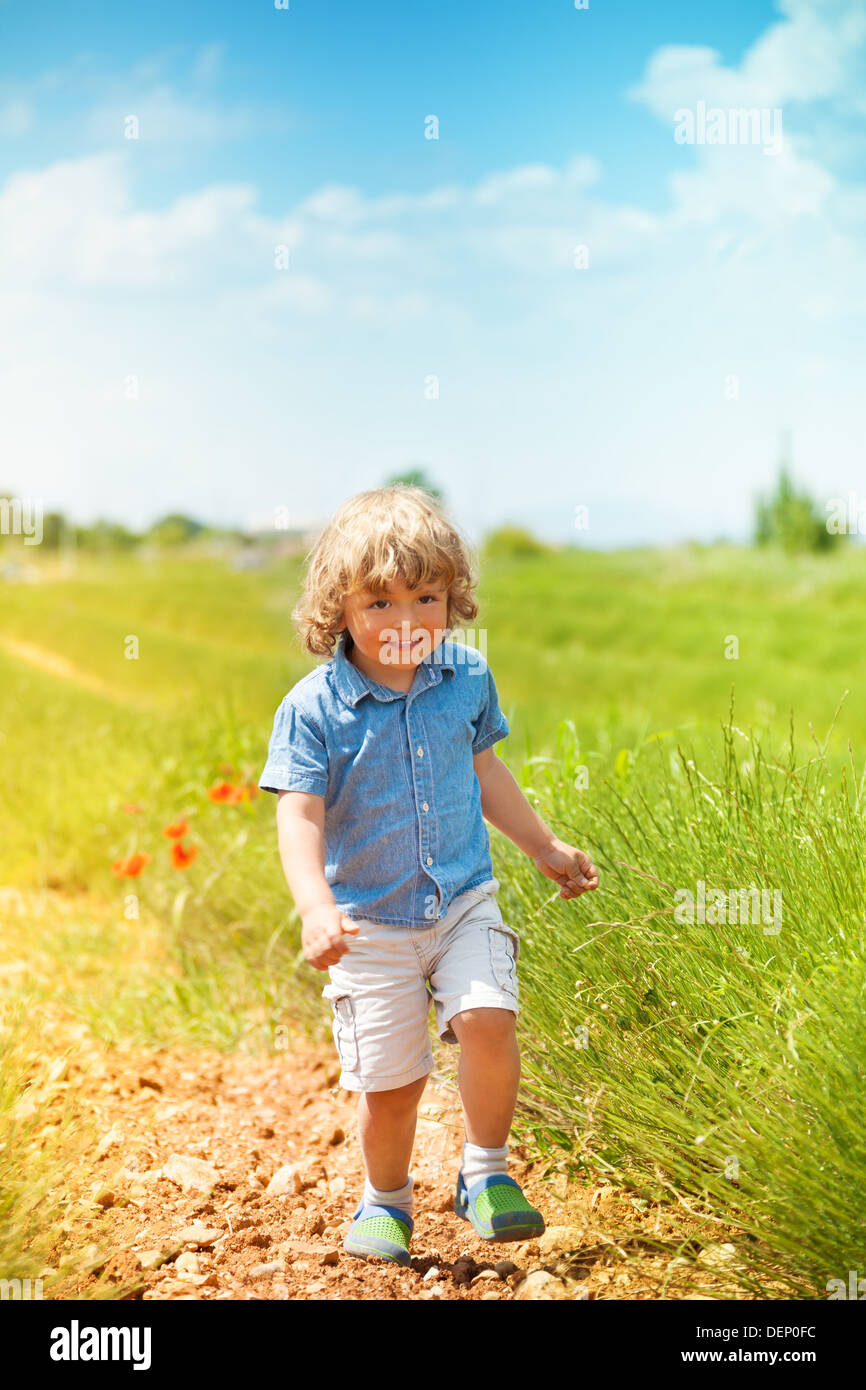 Children running in field flowers hi-res stock photography and images ...