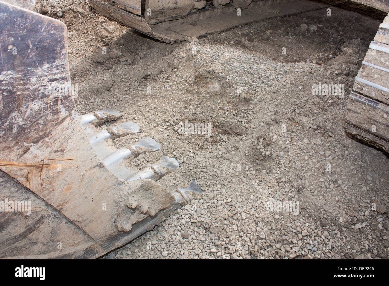 An excavator in the dirt on a construction job site Stock Photo - Alamy