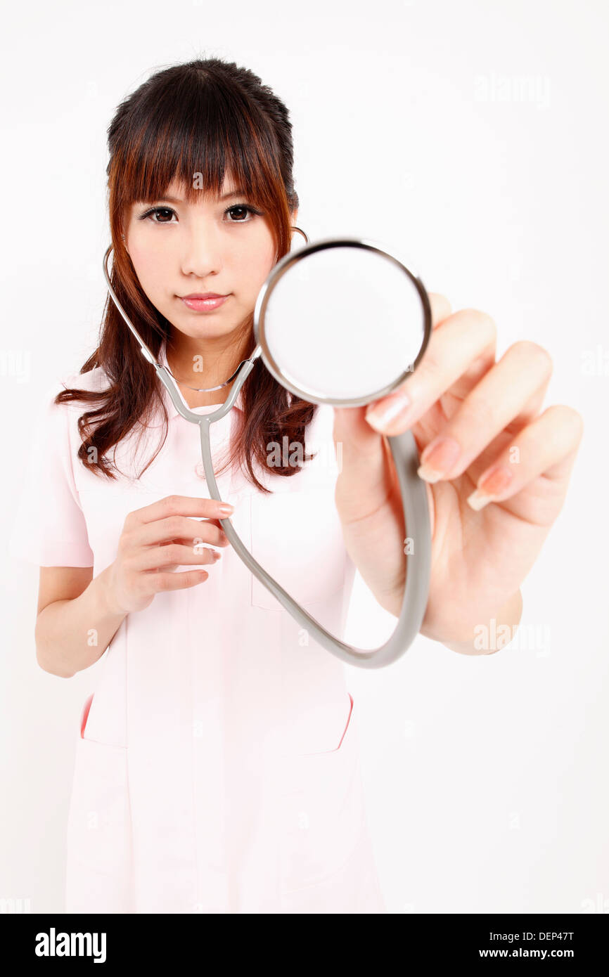 Nurse takes stethoscope Stock Photo - Alamy