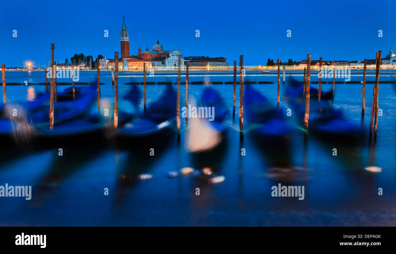 italy venice piazza pier with gondola at posts floating tidal water at ...