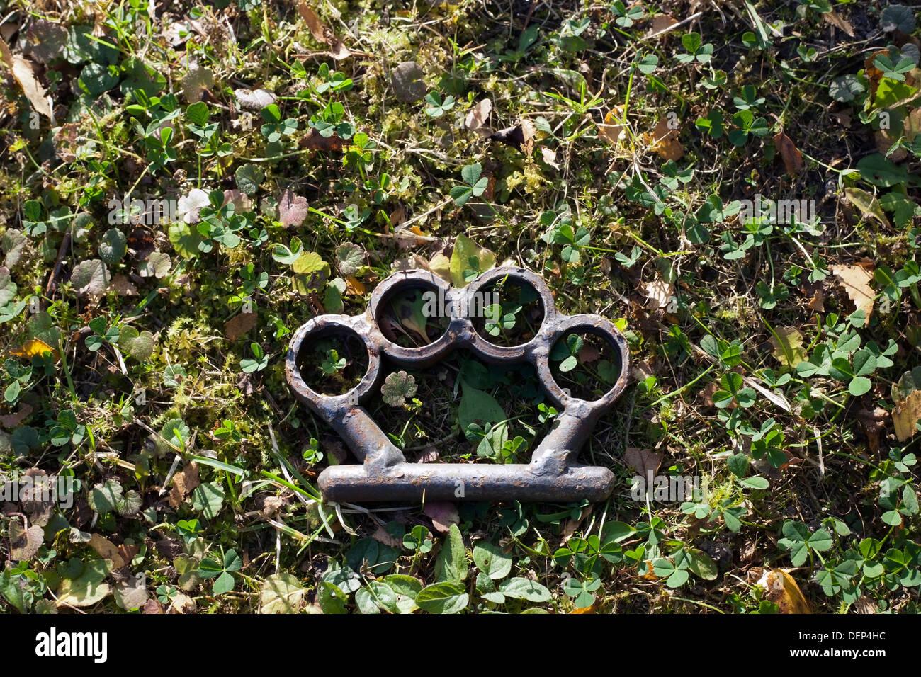 brass knuckles on ground Stock Photo - Alamy