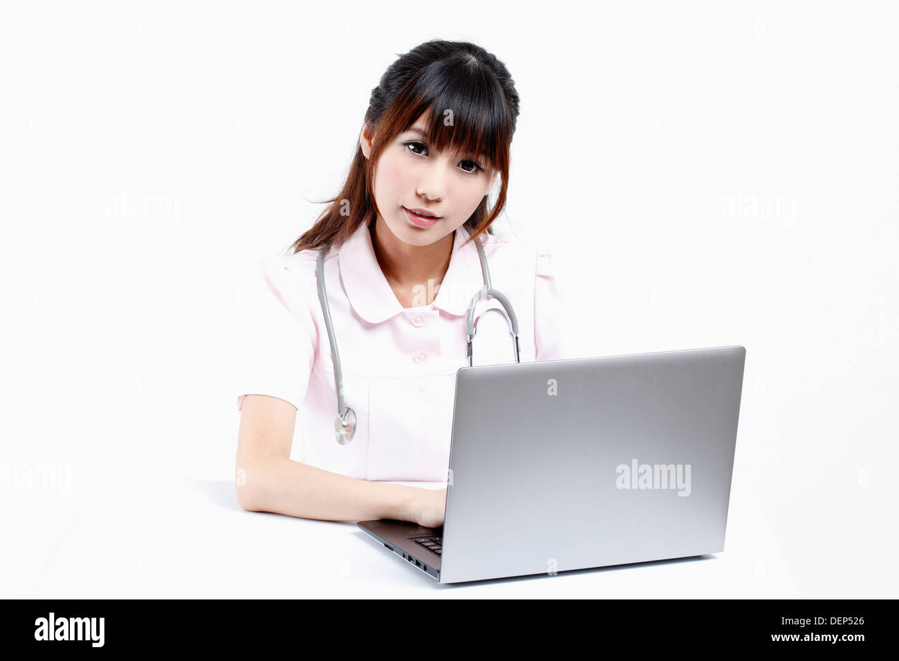 Nurse works with computer Stock Photo - Alamy