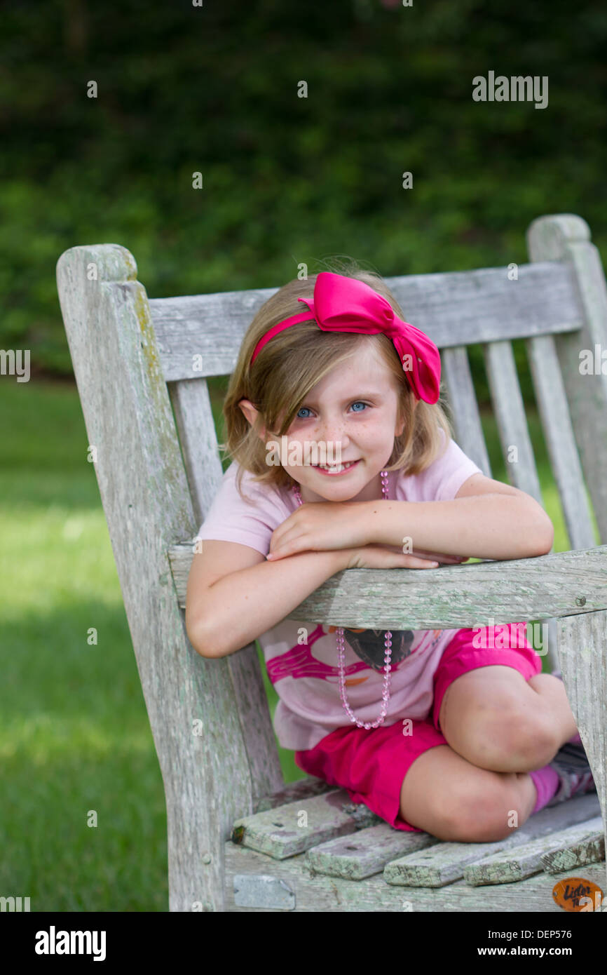 Girl posing on bench hi-res stock photography and images - Alamy