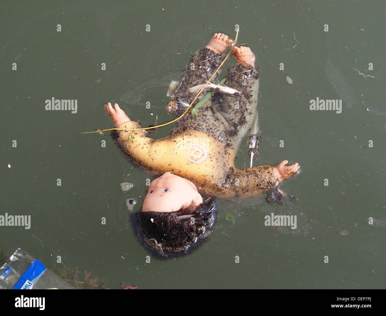 Doll floating in the water in Nancy, 2 Stock Photo - Alamy